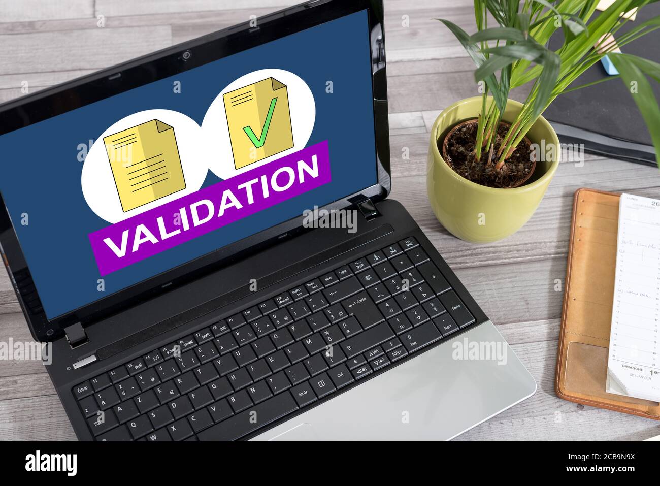 Laptop screen with document validation concept Stock Photo - Alamy