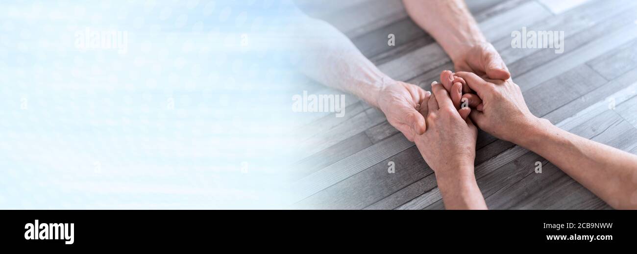 Couple holding their hands on wooden background. panoramic banner Stock ...