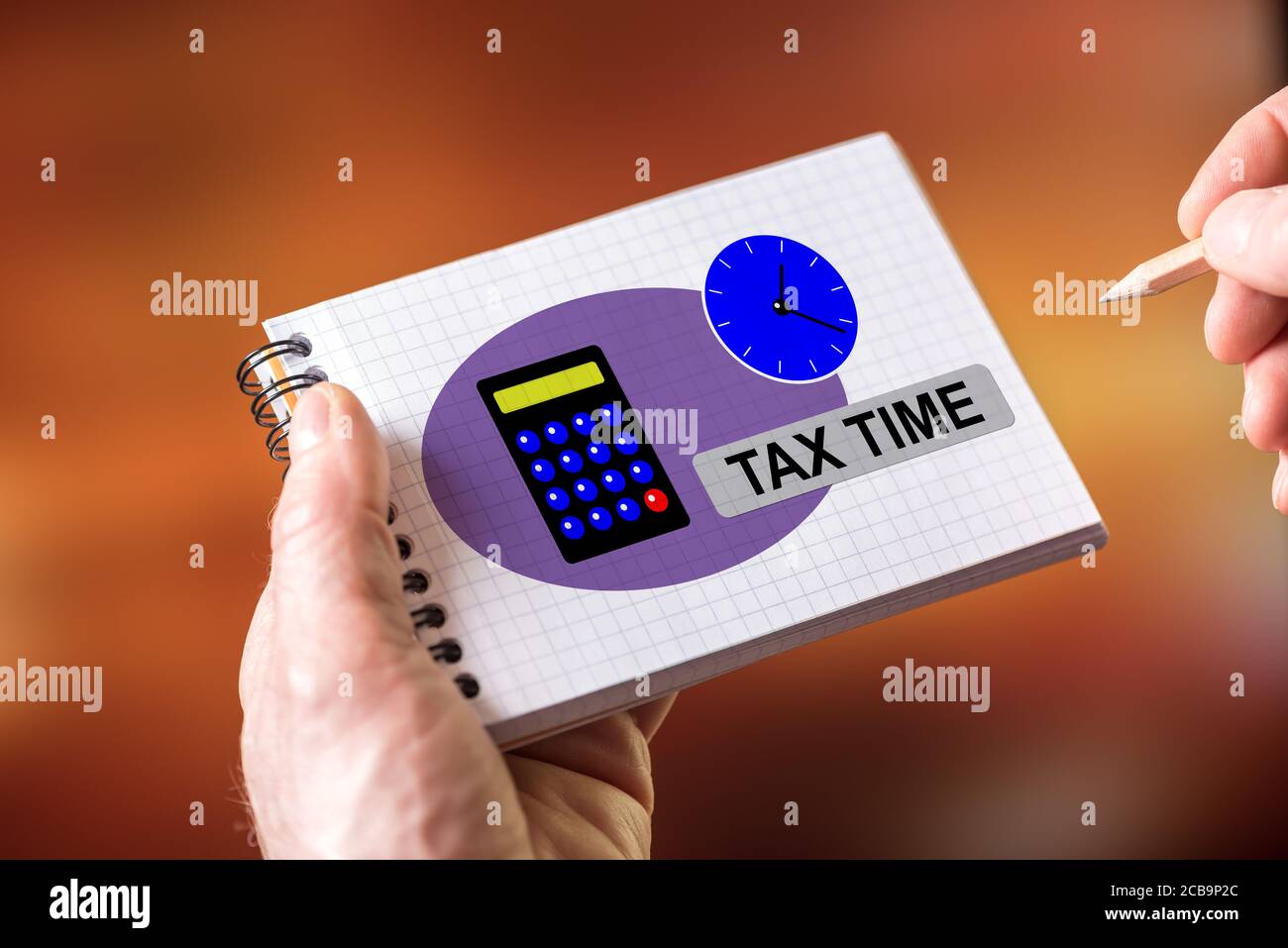Hand drawing tax time concept on a notepad Stock Photo - Alamy
