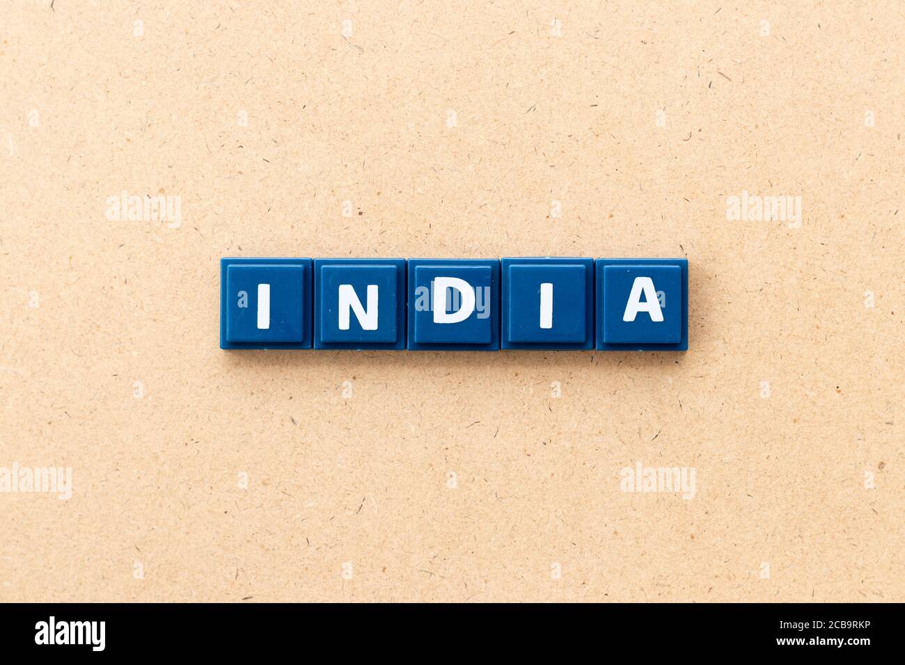 Tile letter in word India on wood background Stock Photo - Alamy