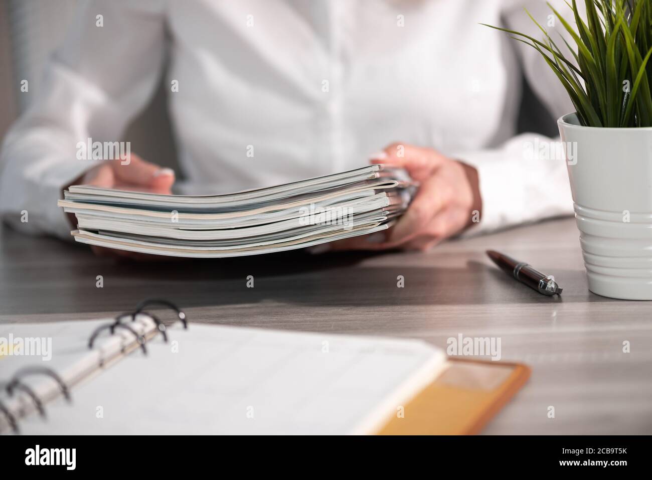 Holding magazines stack hi-res stock photography and images - Alamy