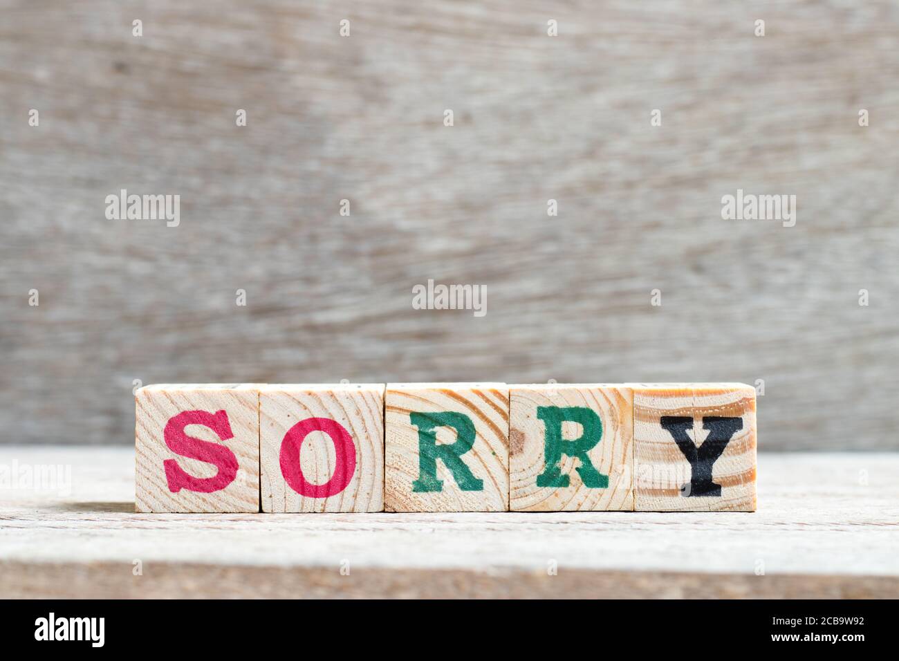 Letter block in word sorry on wood background Stock Photo - Alamy
