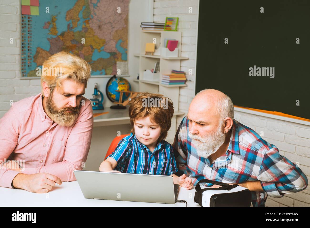 Mature grandpa teaching grandchild hi-res stock photography and images ...
