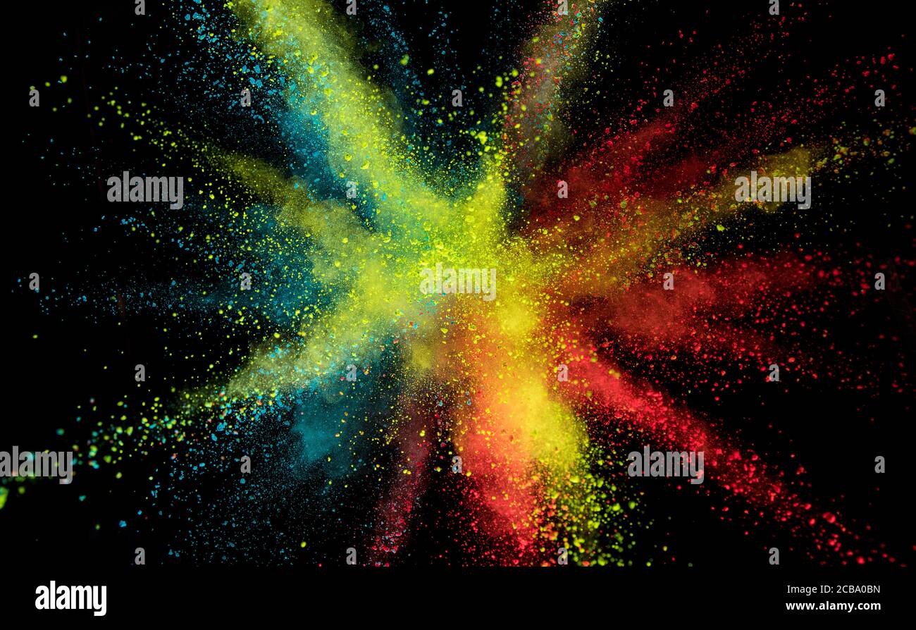 Multi colored powder explosion isolated on black background. Freeze ...