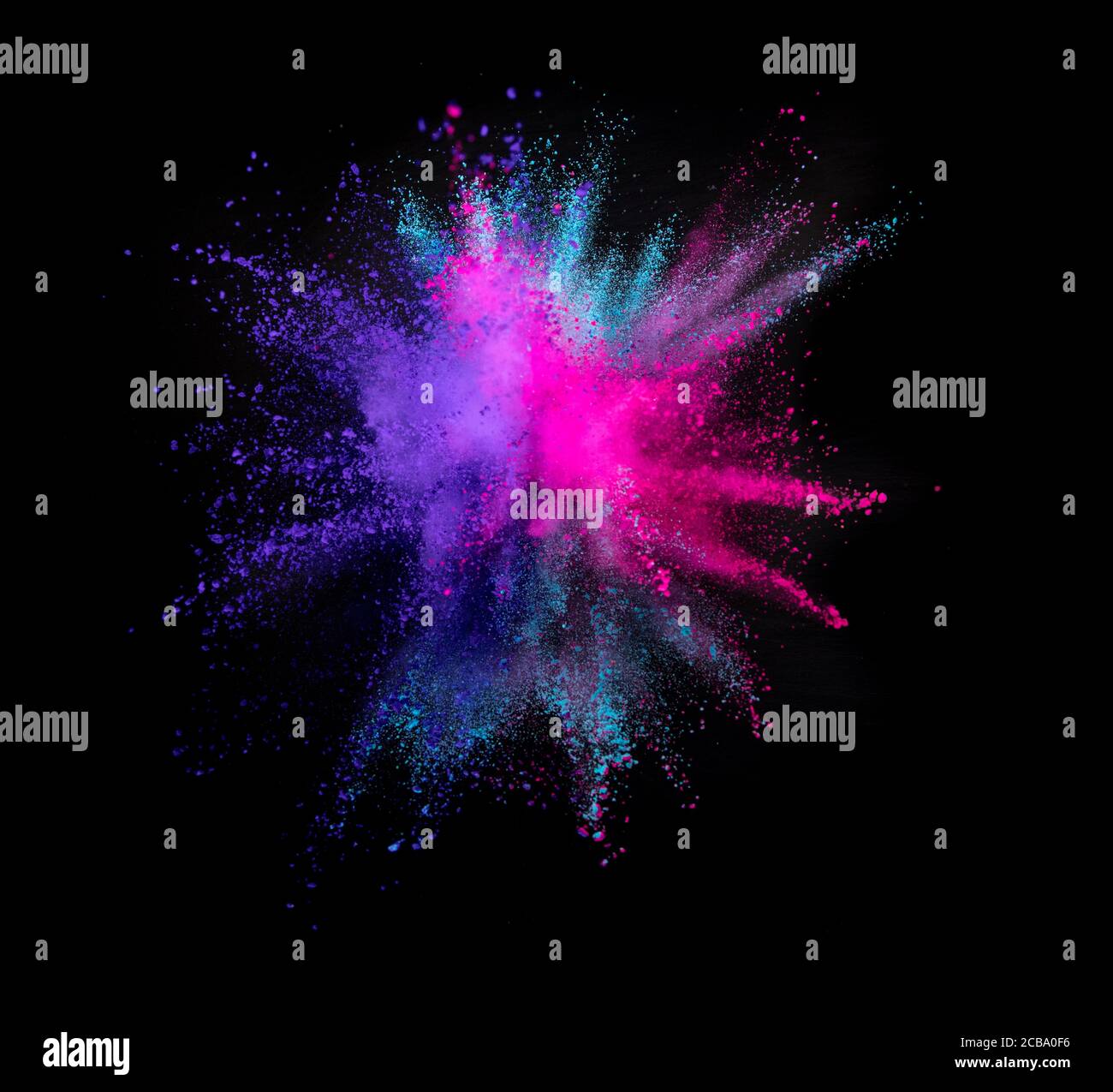 Multi colored powder explosion isolated on black background. Freeze ...
