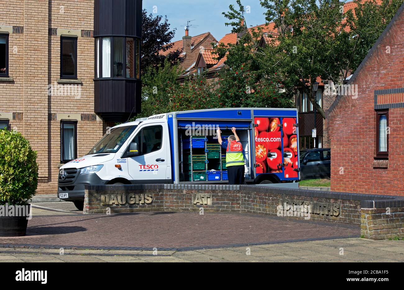 Tesco delivery van in residential street, England UK Stock Photo - Alamy