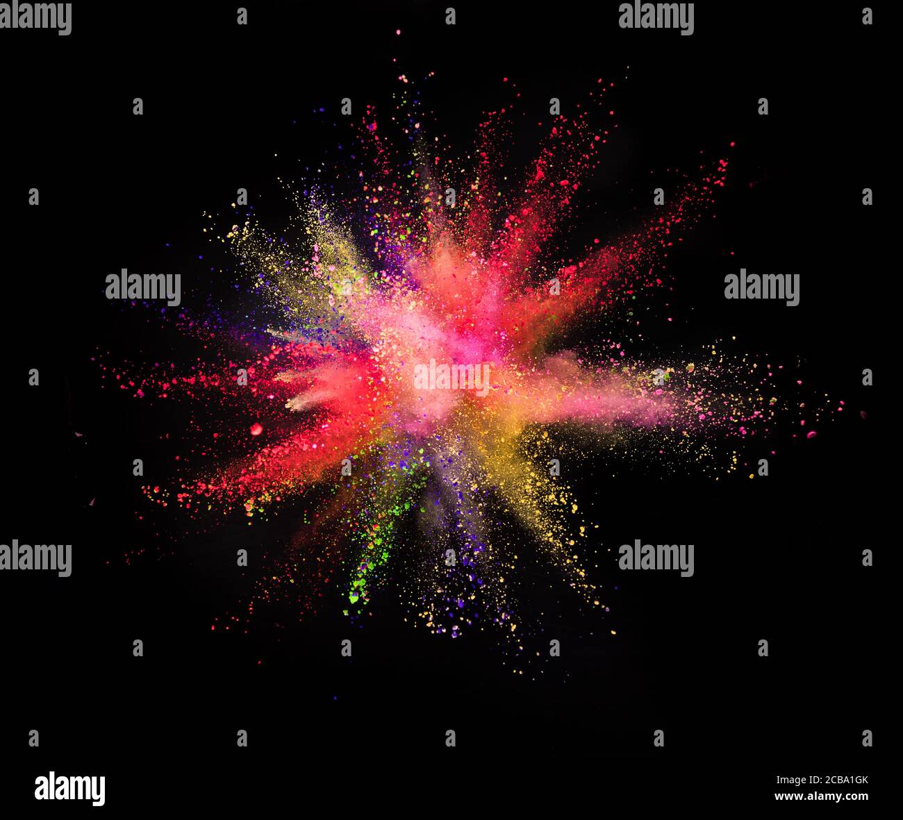 Multi colored powder explosion isolated on black background. Freeze ...