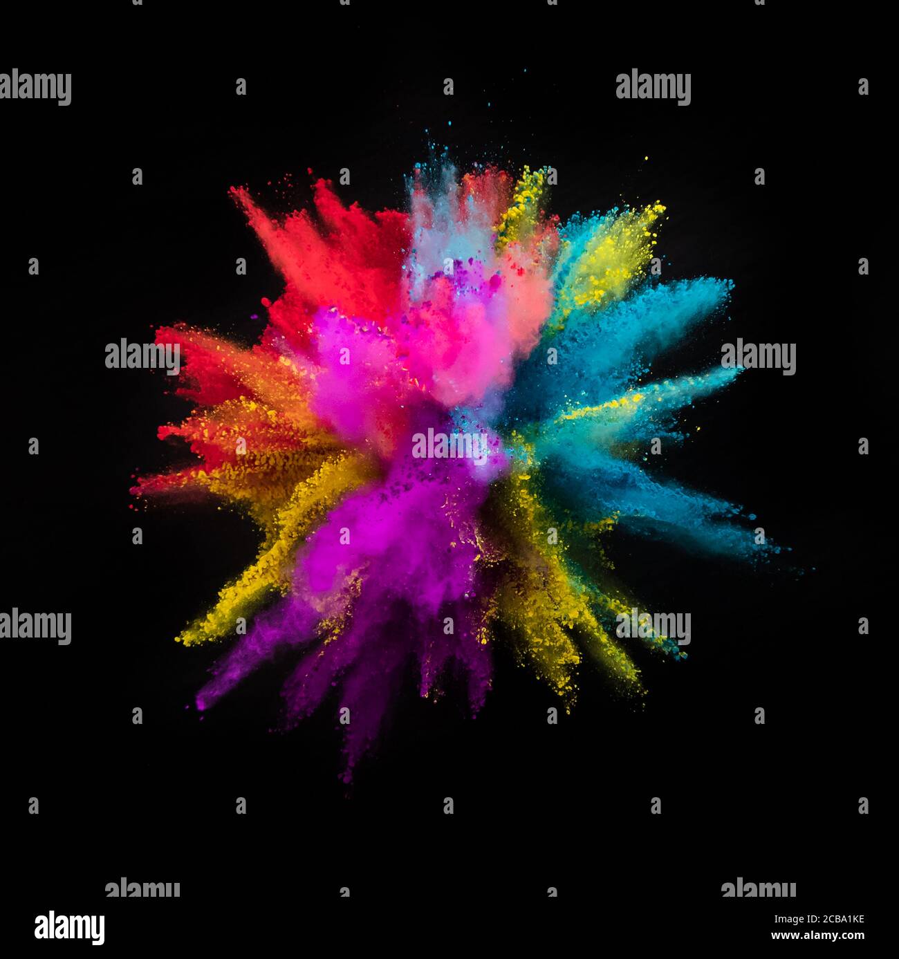 Multi colored powder explosion isolated on black background. Freeze ...