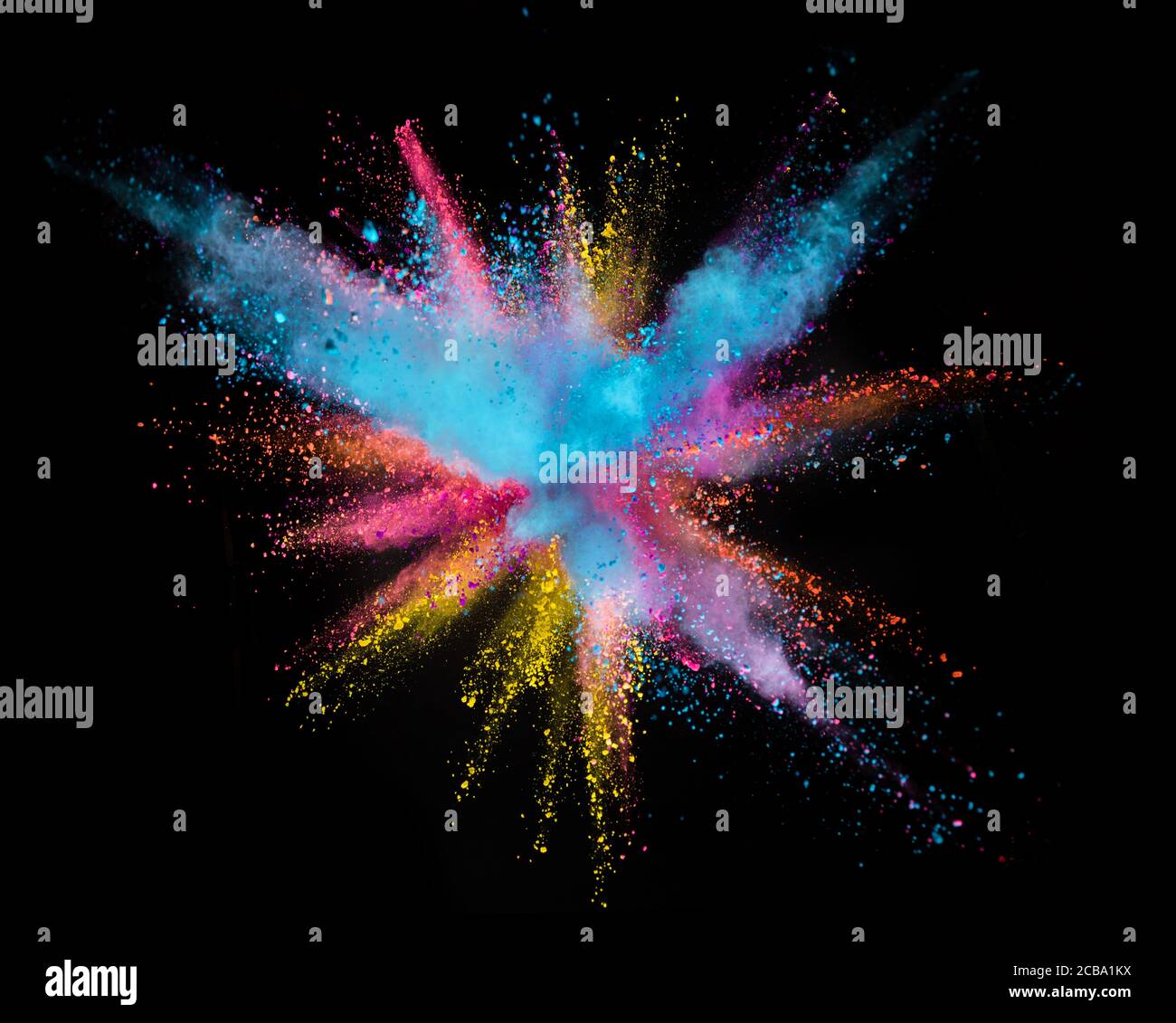 Multi colored powder explosion isolated on black background. Freeze ...