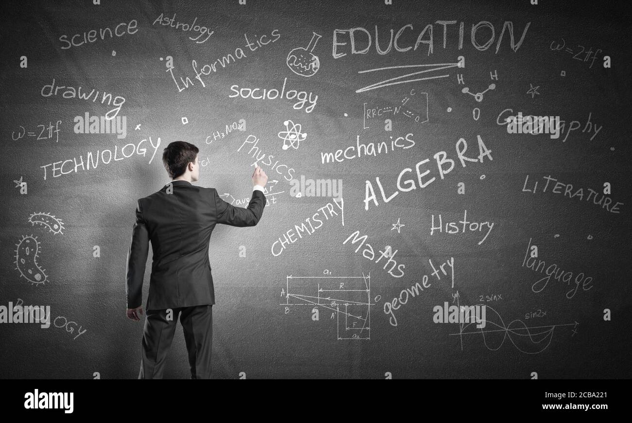 Man draw on chalkboard Stock Photo - Alamy