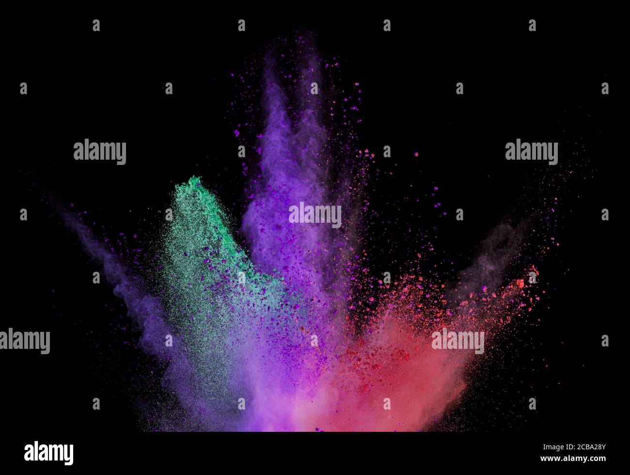 Explosion of colored powder isolated on black background. Abstract ...