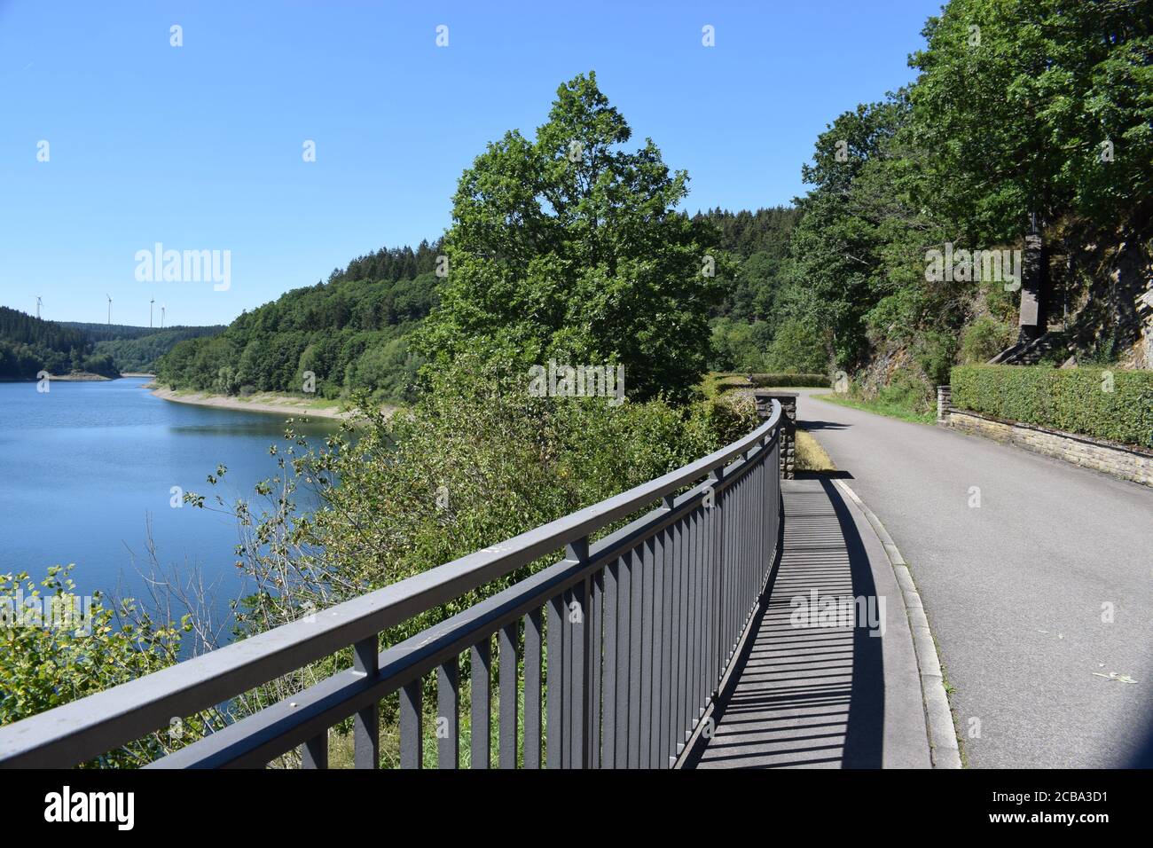 lakeside of the dam wall of Oleftalsperre with the water height scale Stock Photo - Alamy