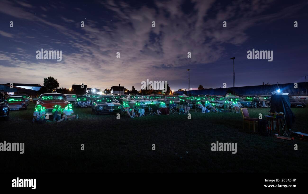 Cars at a drive in movie at night Stock Photo - Alamy