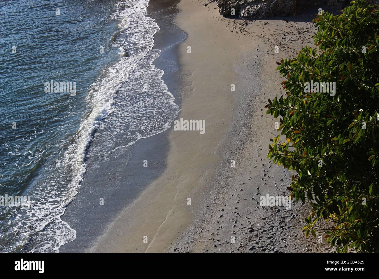Aerial view of an empty, tropical beach on a peaceful day Stock Photo ...