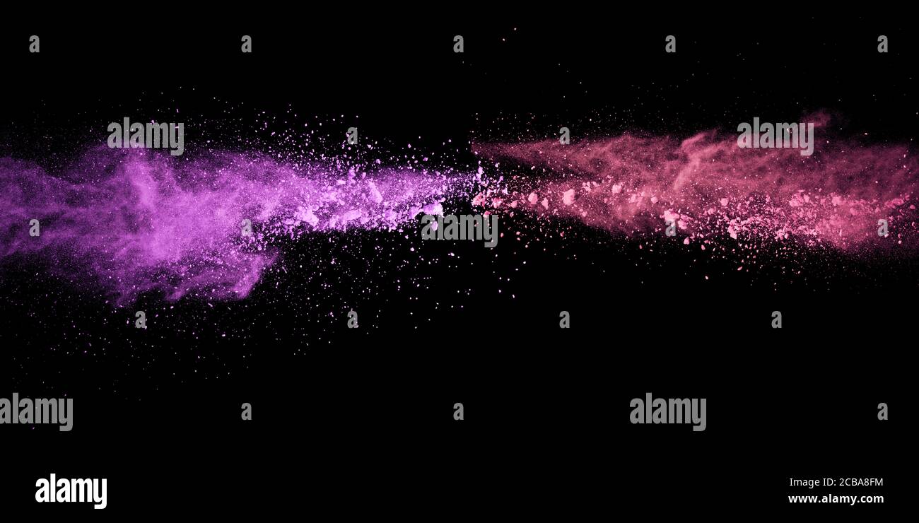 Abstract colored powder explosion isolated on black background. High ...