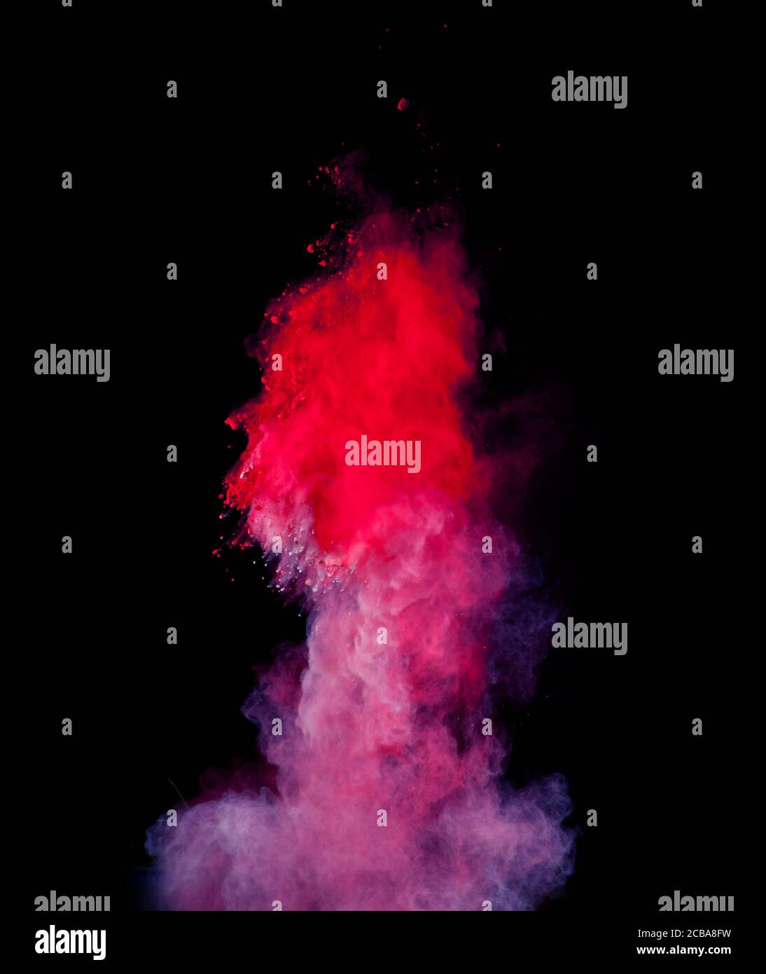 Abstract colored powder explosion isolated on black background. High ...