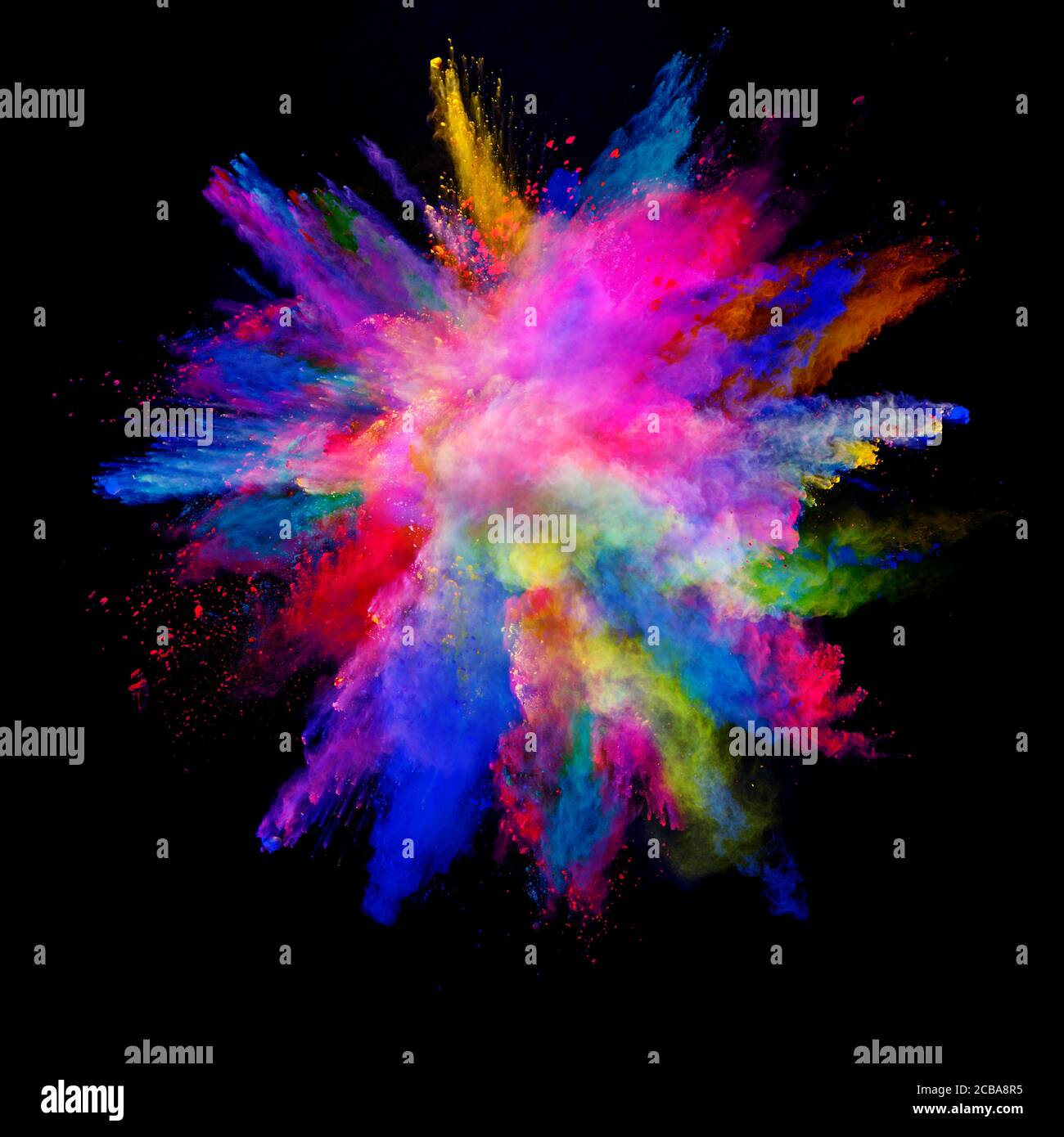 Abstract colored powder explosion isolated on black background. High ...