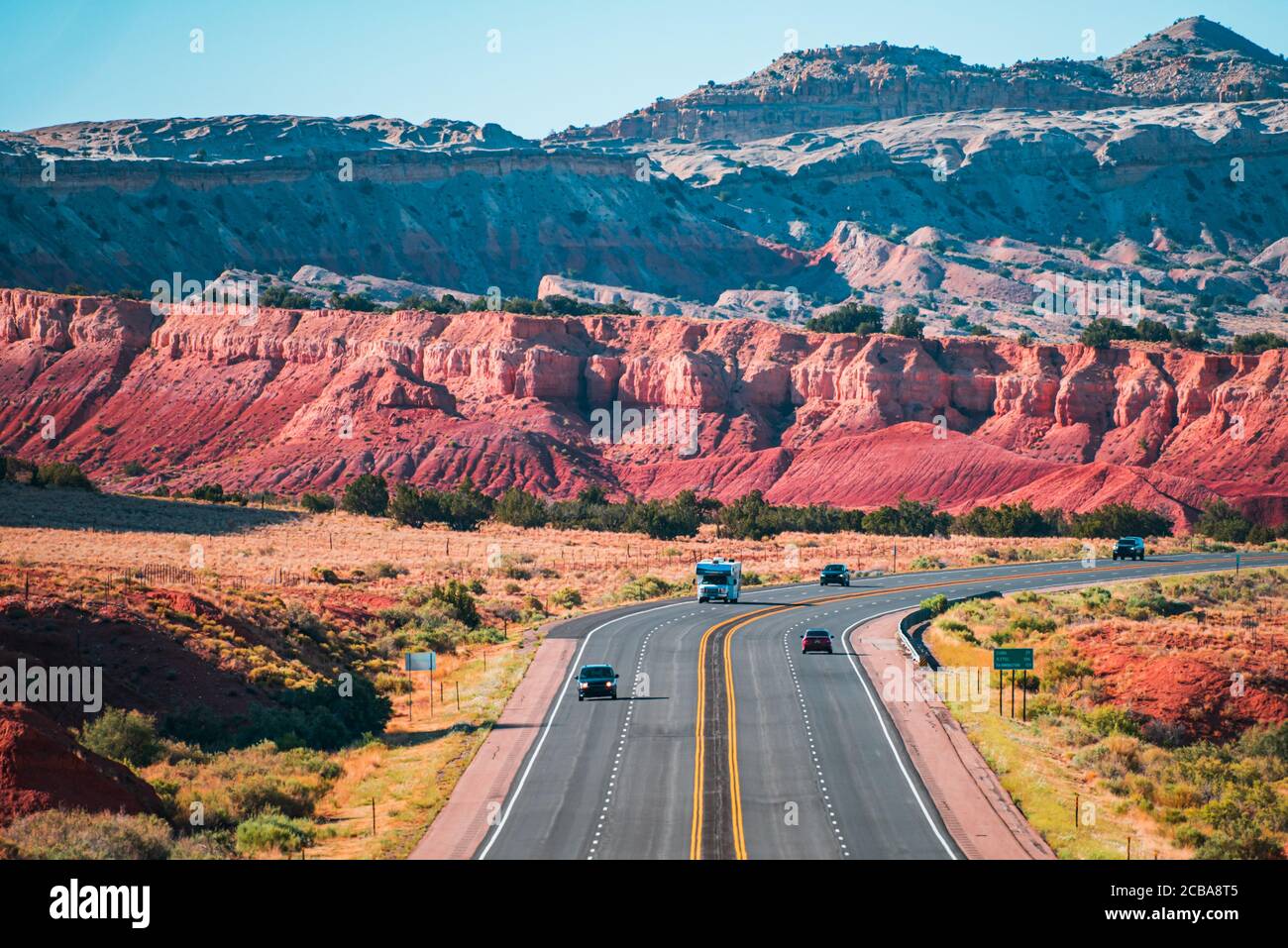 Asphalt highway and hill landscape under the blue sky. Curved Arizona ...