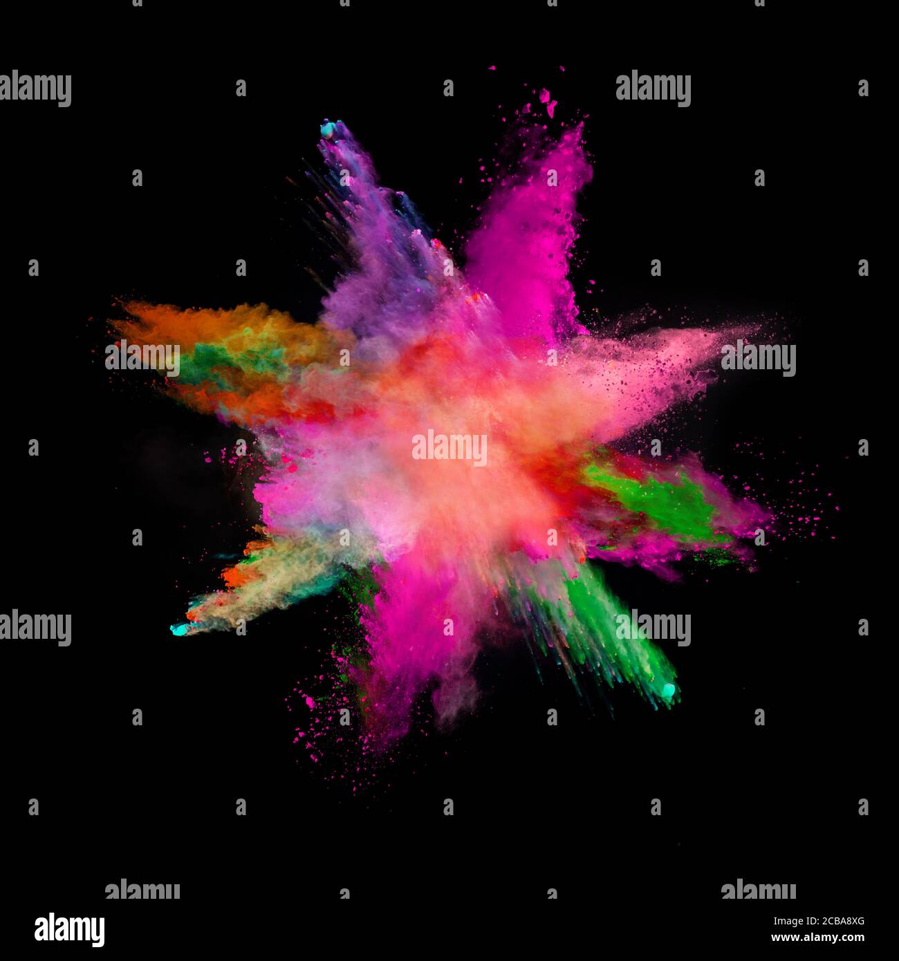 Abstract colored powder explosion isolated on black background. High ...