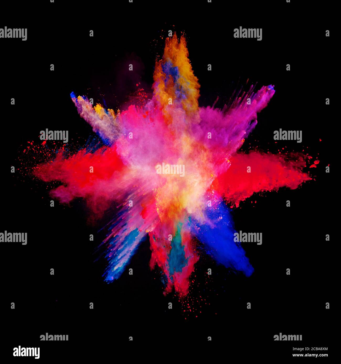 Abstract colored powder explosion isolated on black background. High ...