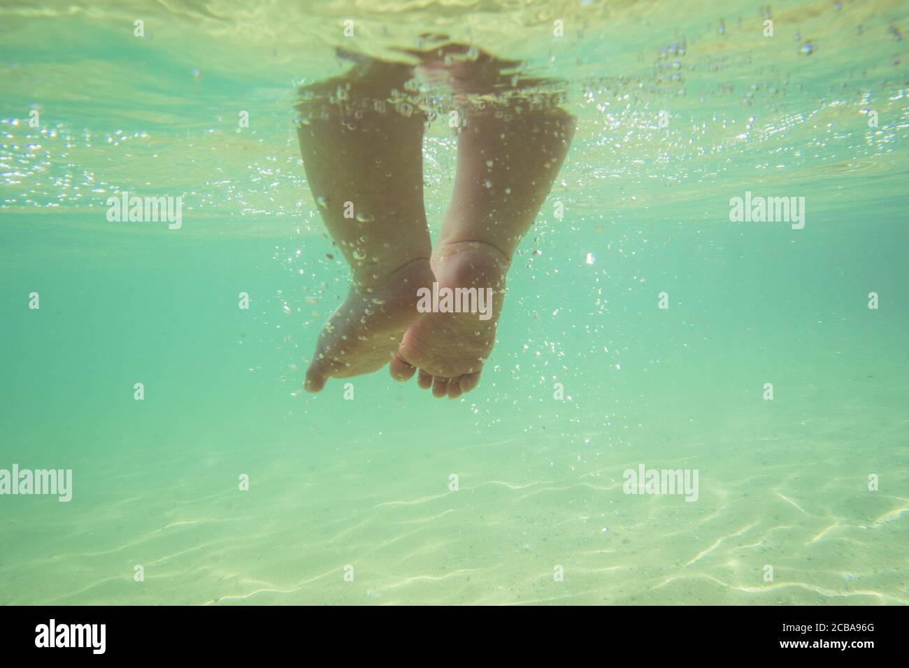 Baby foot sand toes hi-res stock photography and images - Alamy