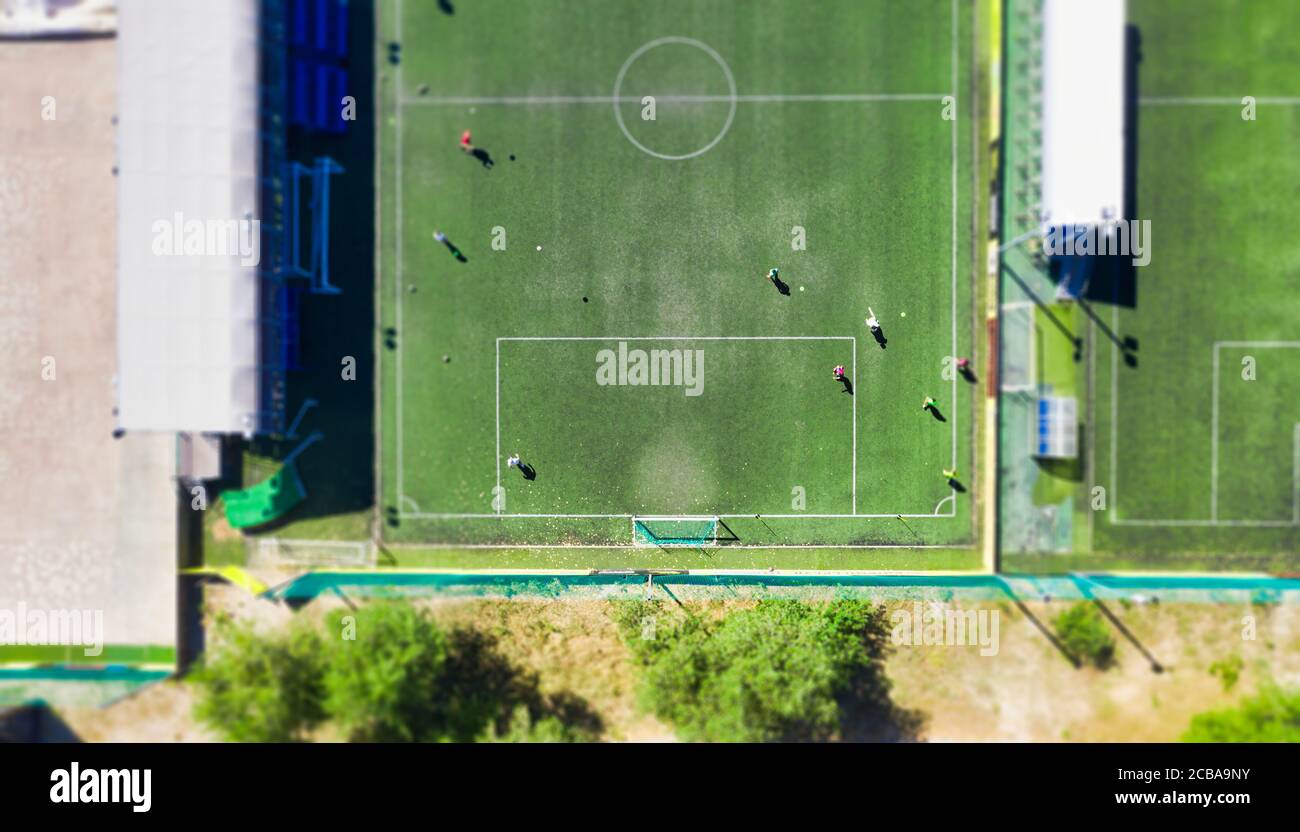 Training of football team players on the green grass of the football ...