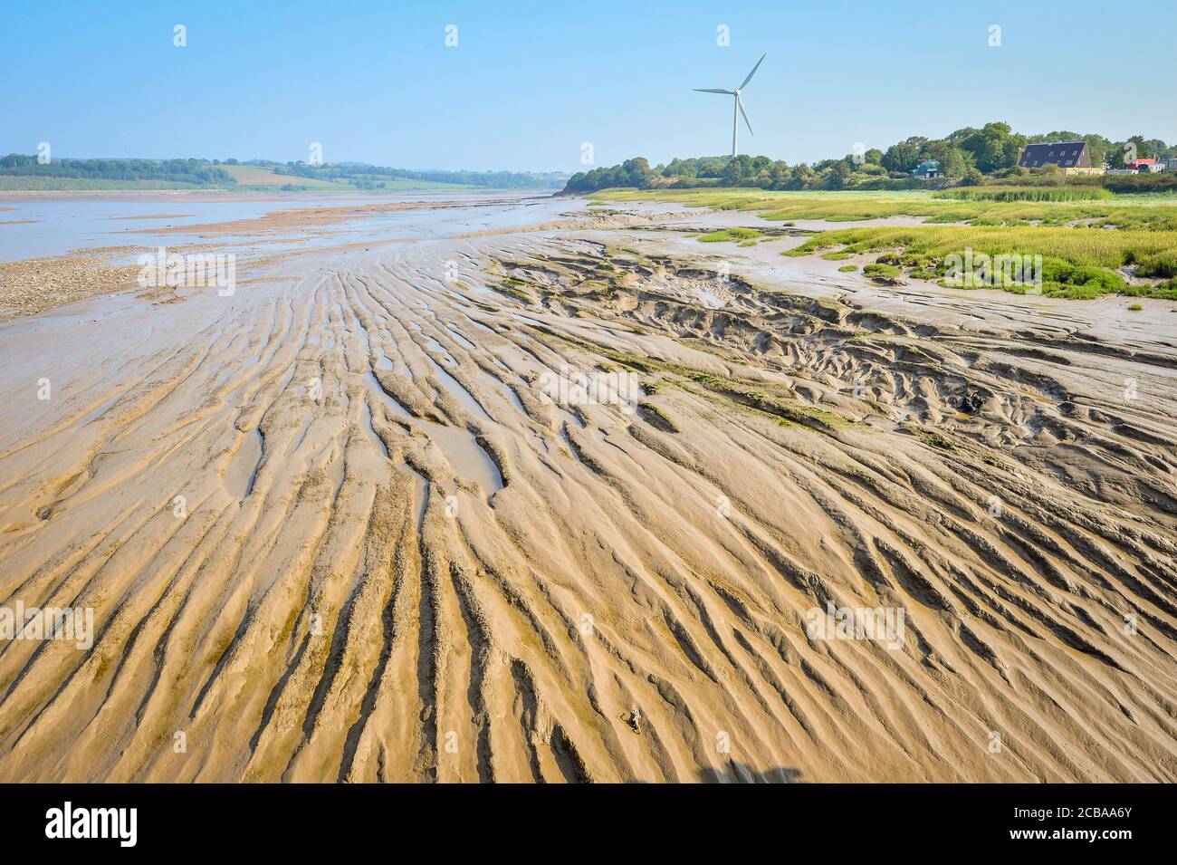 Lines in mud and silt are exposed during low tide on the River Severn ...