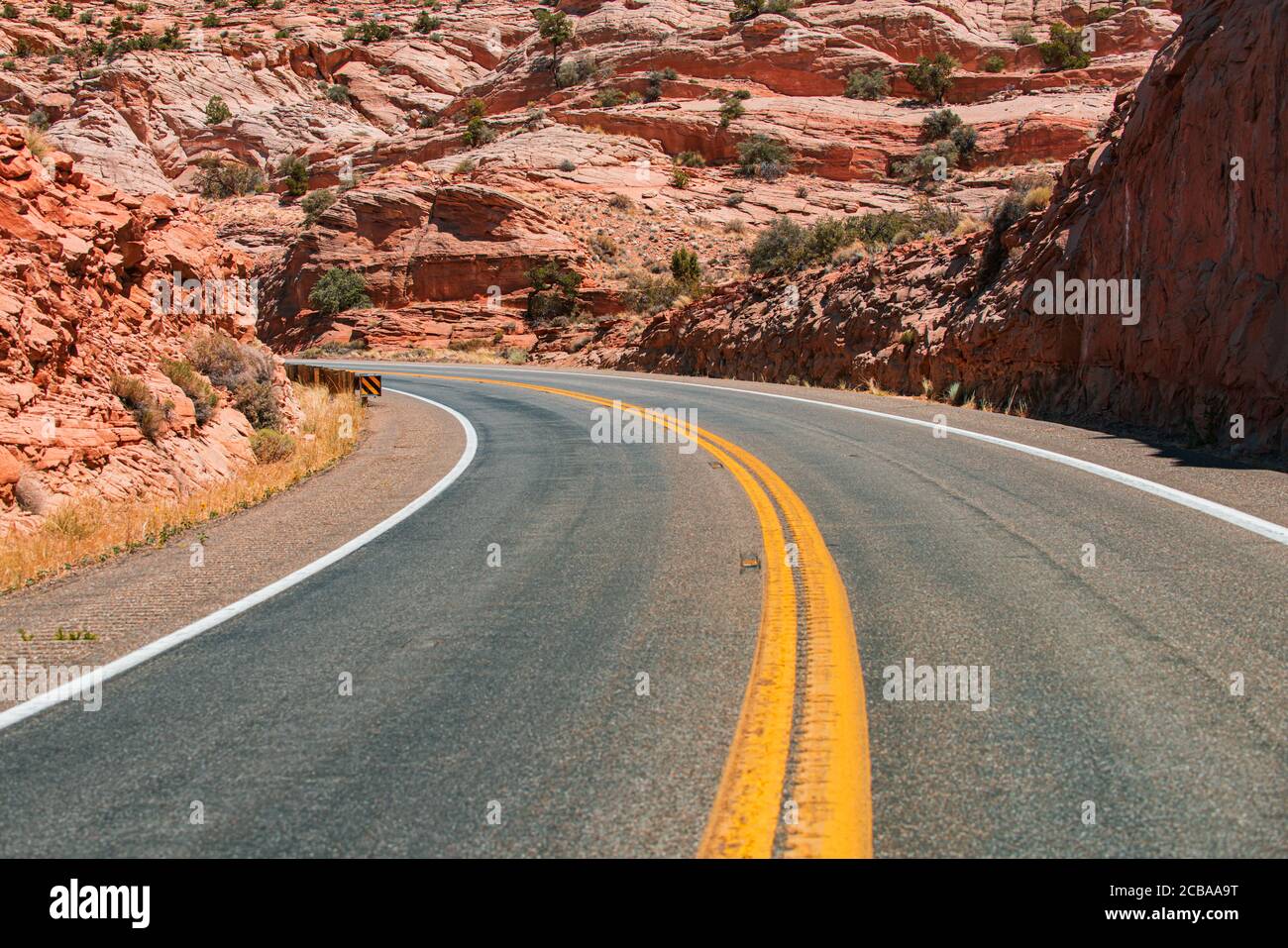 Landscape with orange rocks and asphalt road in summer Stock Photo - Alamy