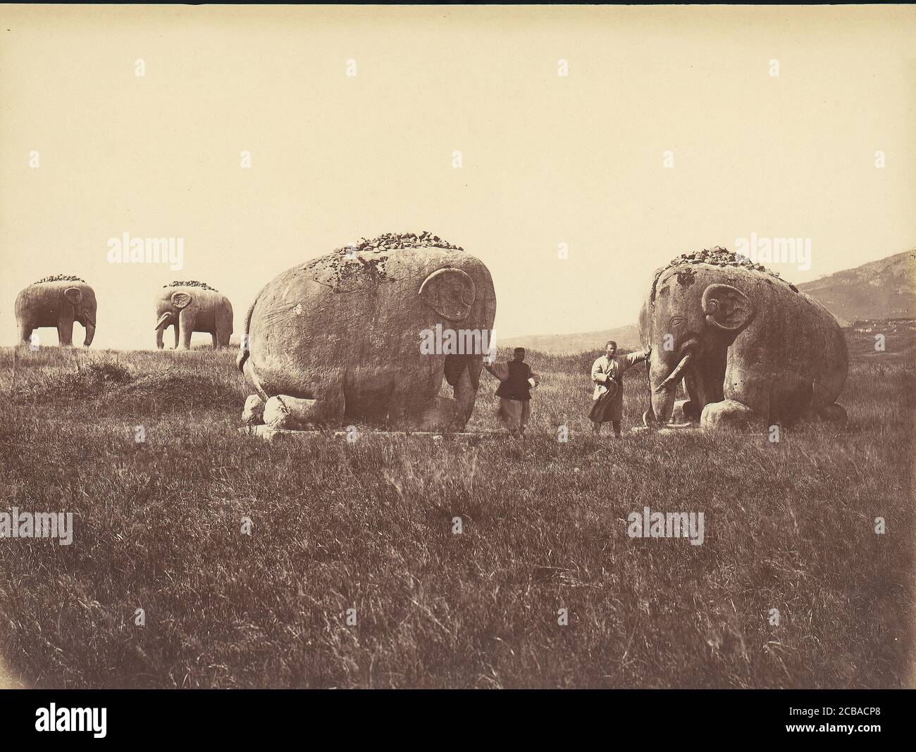 Two Men by Monumental Elephant Statues, China, 1860s-70s Stock Photo ...