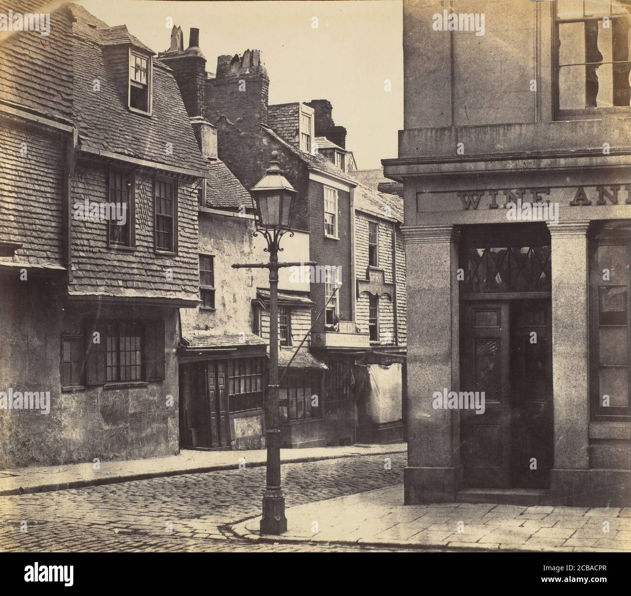 Street with Lamp Post and Wine Shop, 1850s Stock Photo - Alamy
