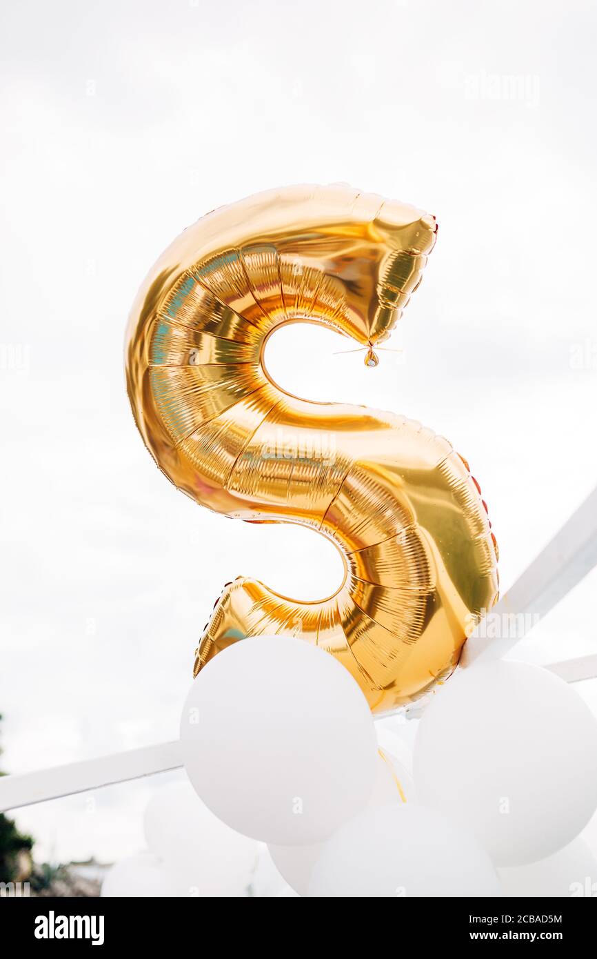 Gold foil letter balloon hi-res stock photography and images - Alamy