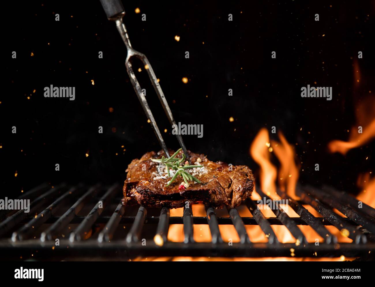 Fiery grill grid with piece of beef steak. Free space for text Stock ...
