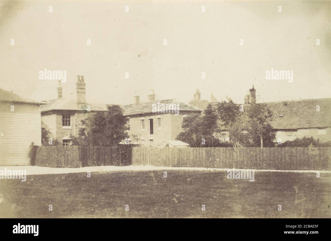 Compound of Buildings Surrounded by Fence, 1850s Stock Photo - Alamy