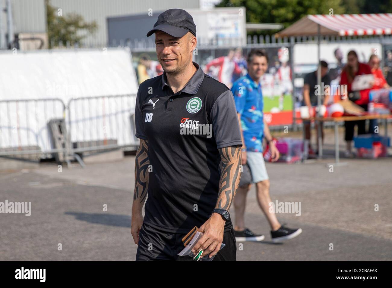 Sinan Bakis signs a contract at Heracles Almelo Stock Photo - Alamy