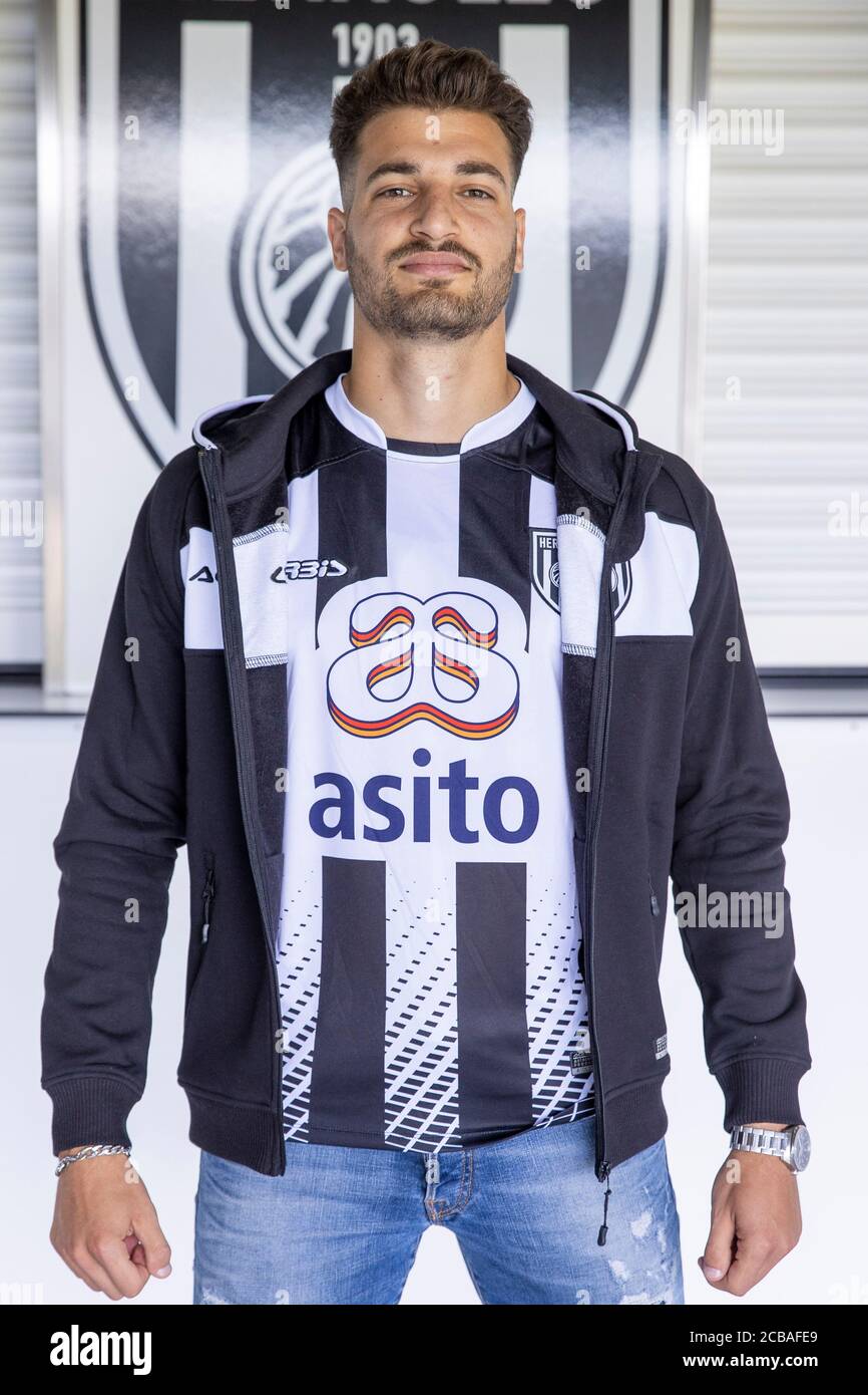 Sinan Bakis signs a contract at Heracles Almelo Stock Photo - Alamy