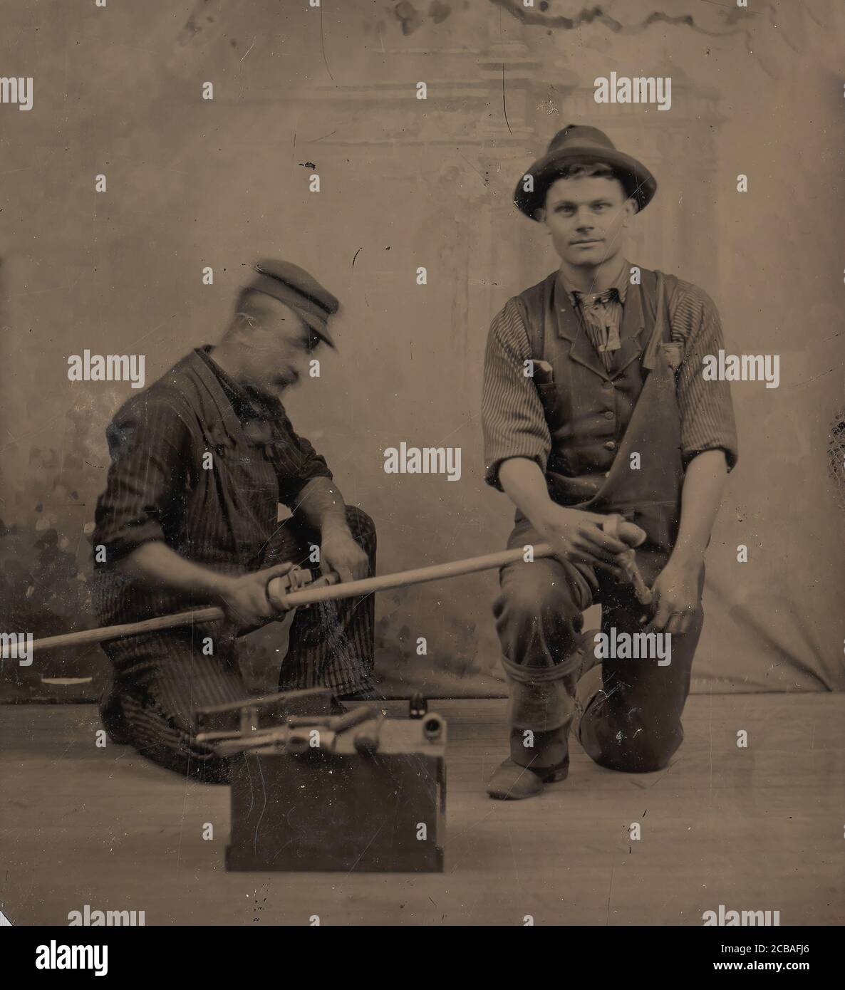 Two Plumbers with a Pipe, Pipe Cutter, and Toolbox, 1870s-80s Stock ...