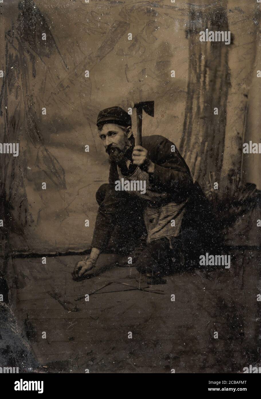 [Kneeling Carpenter Holding a Nail and Raised Hammer], 1870s-80s Stock ...