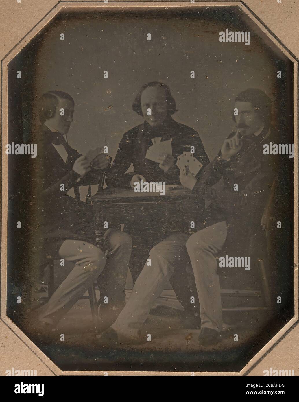 Three men playing cards hi-res stock photography and images - Alamy