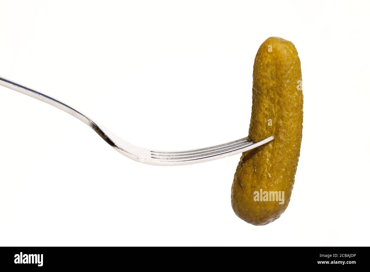 Fork holding a pickle isolated on a white background Stock Photo - Alamy