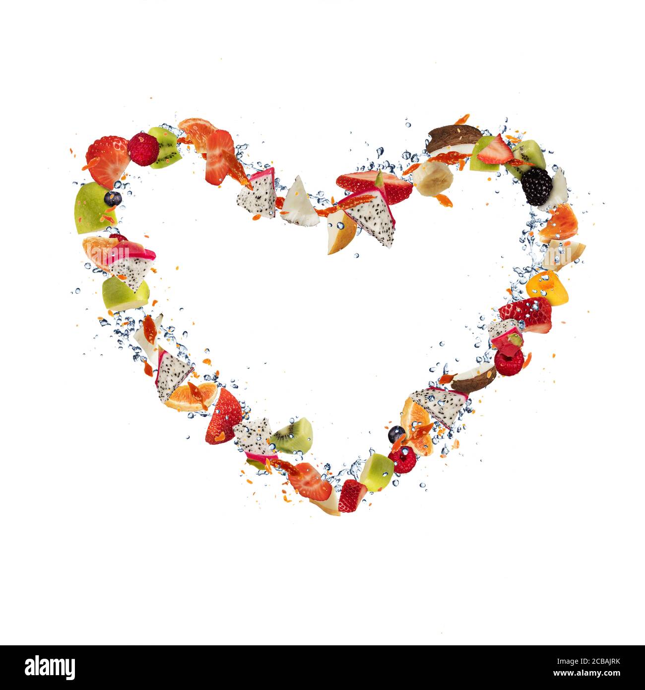Fresh pieces of fruit flying in heart shape, isolated on white ...
