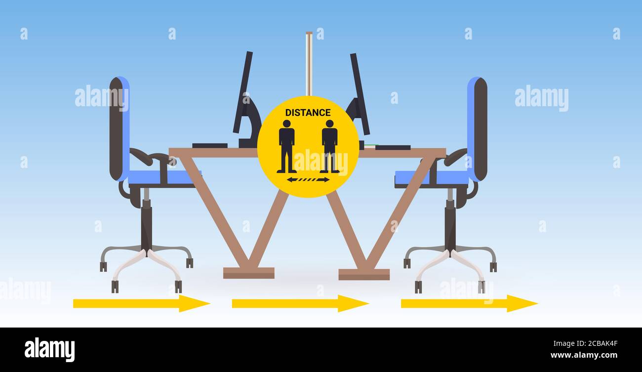 office workplace desk with signs for social distancing yellow stickers ...