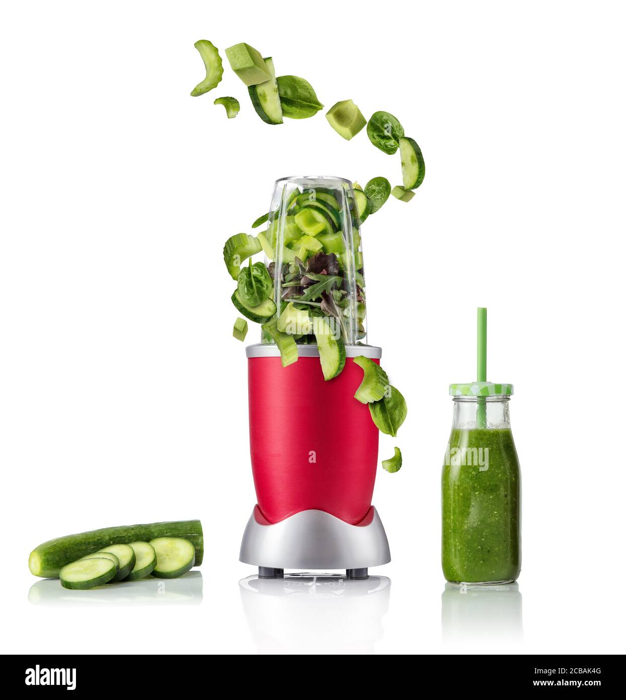Smoothie maker mixer with vegetable flying ingredients, isolated on ...