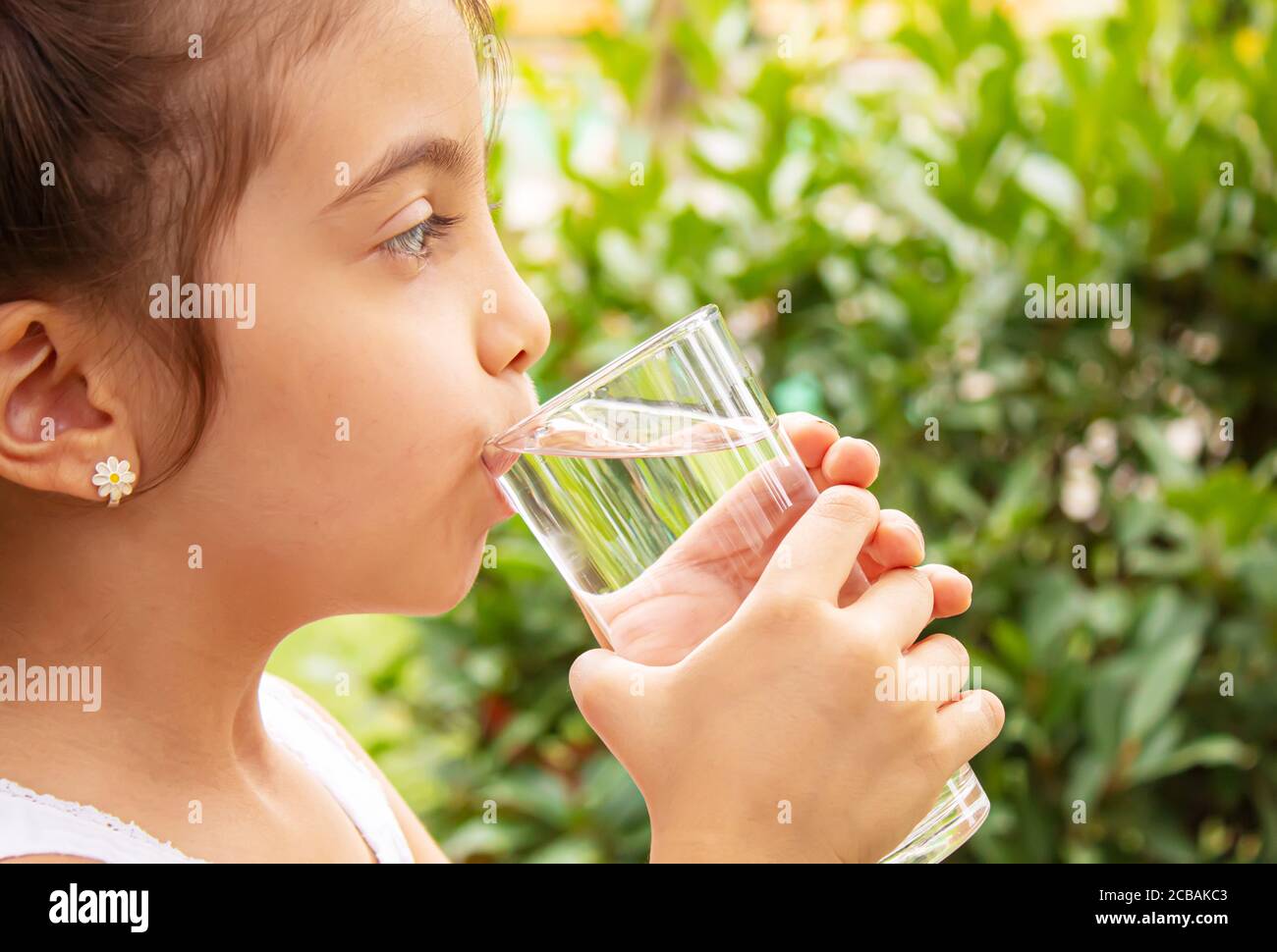 Child drinking pure water in nature.selectiv fokus Stock Photo - Alamy