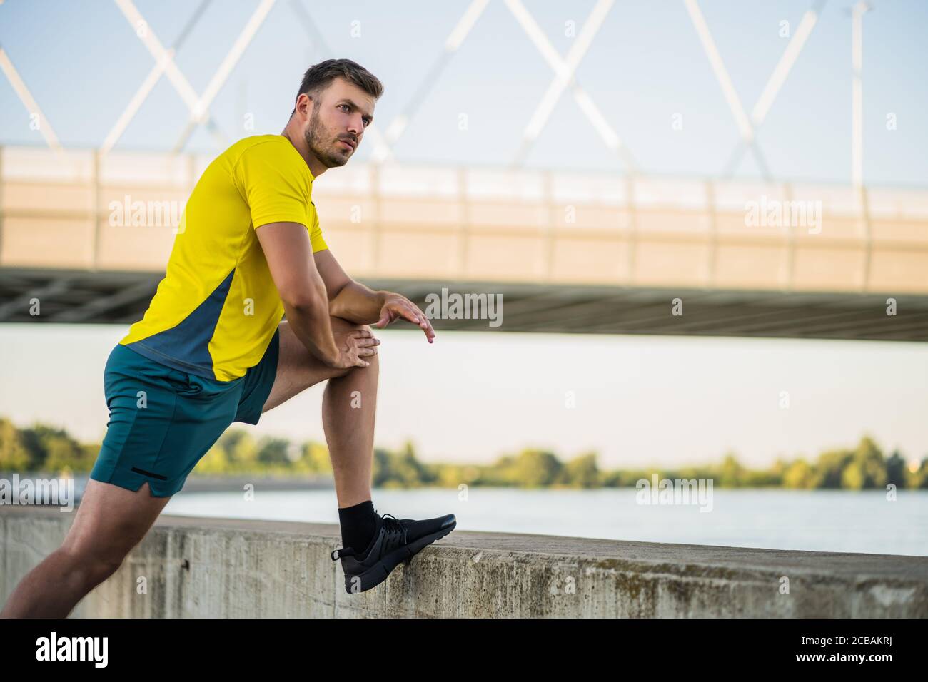 Man one leg up one arm up hi-res stock photography and images - Alamy
