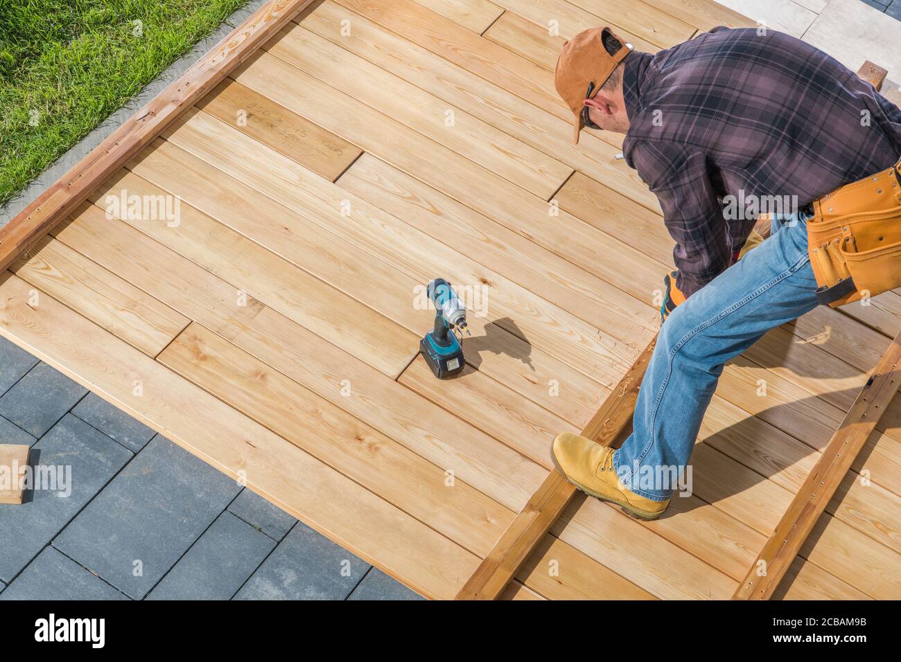 Caucasian Men in His 40s Building Wooden Deck on His Backyard Attaching ...