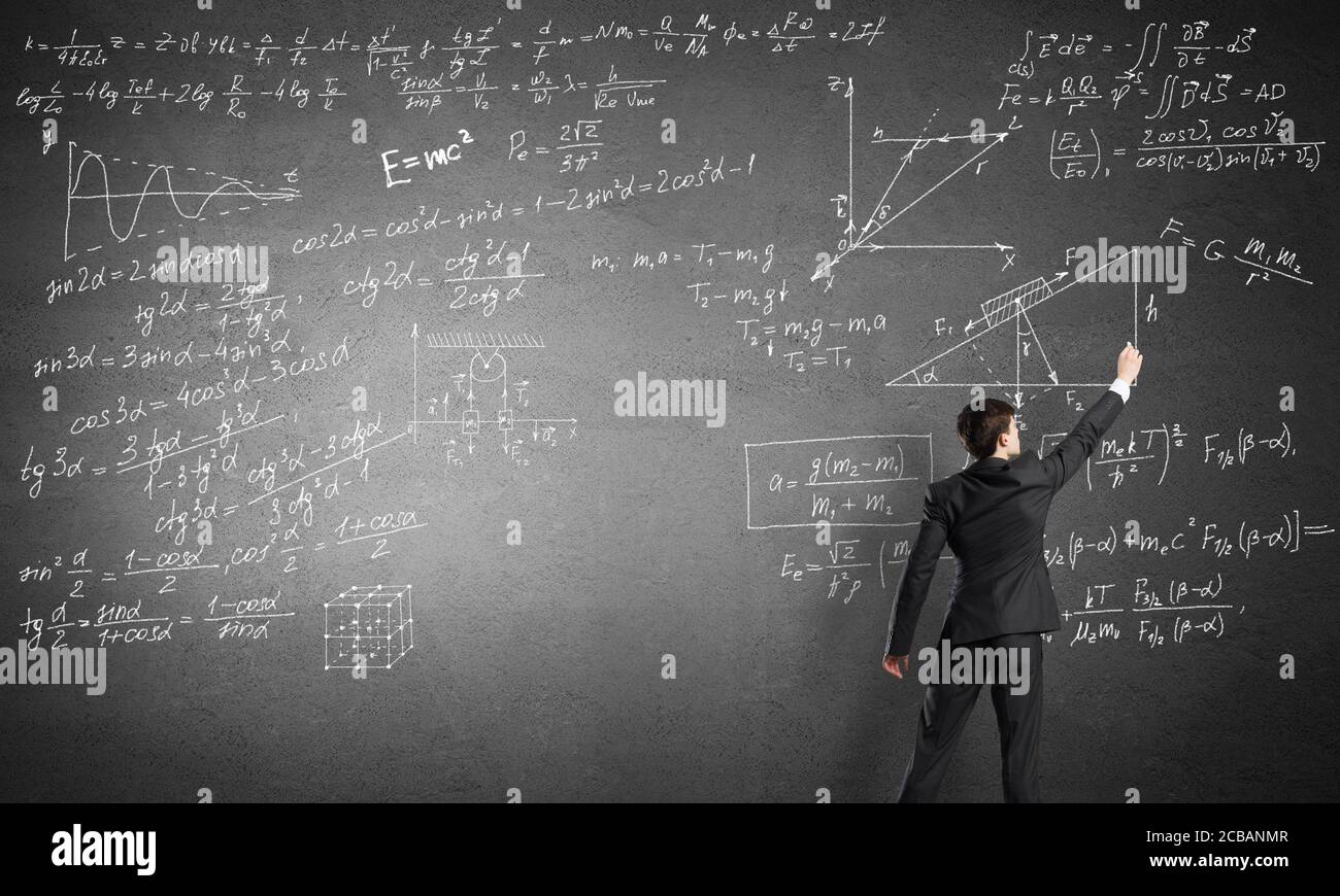 Teacher at the blackboard Stock Photo - Alamy