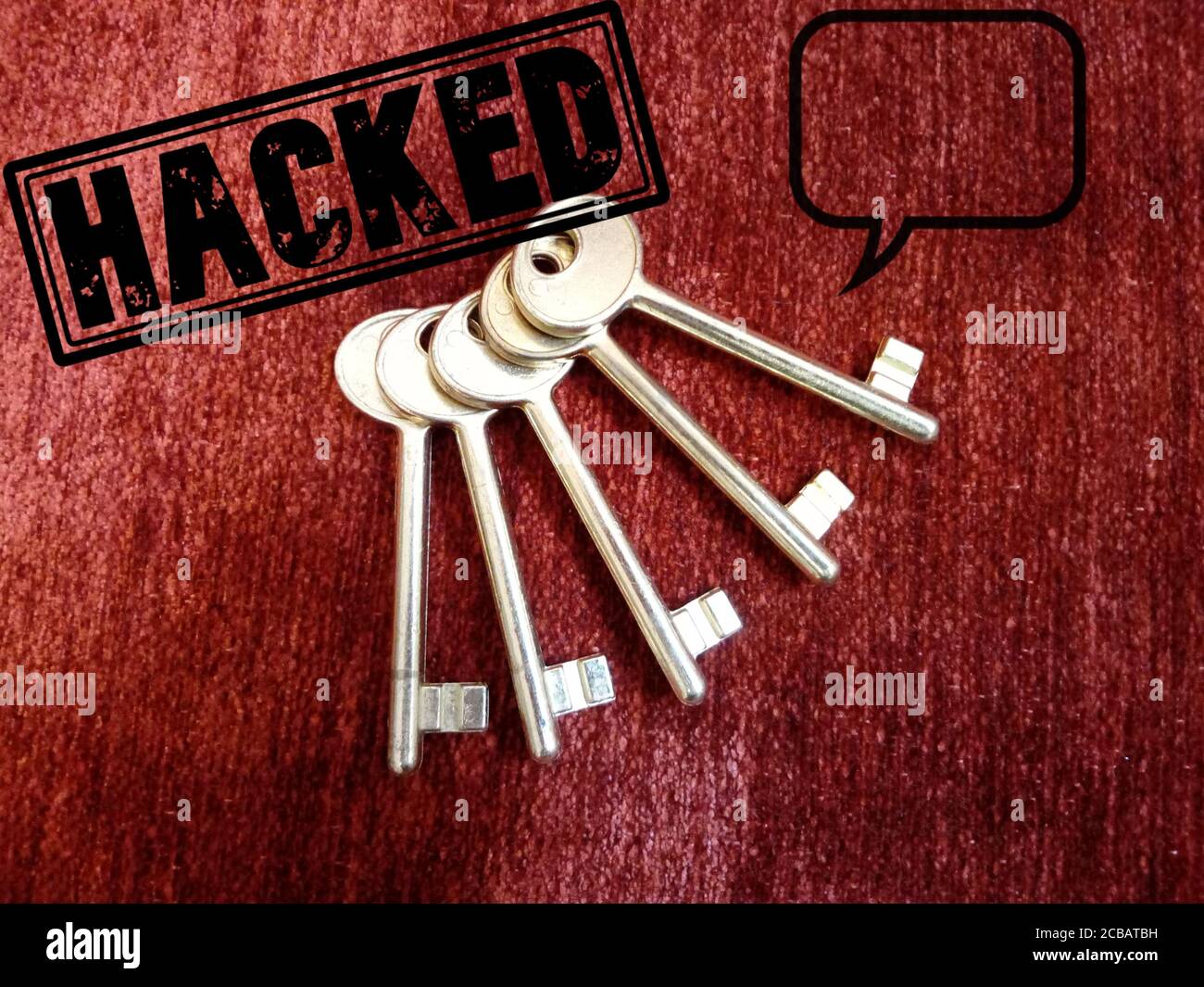 Overhead shot of five golden keys on red textured background with ...