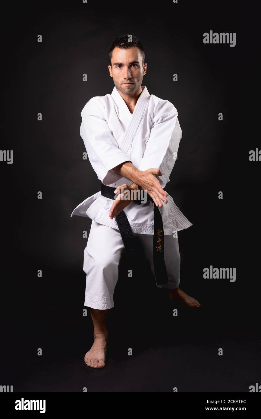 karateka practicing kata with black background Stock Photo - Alamy
