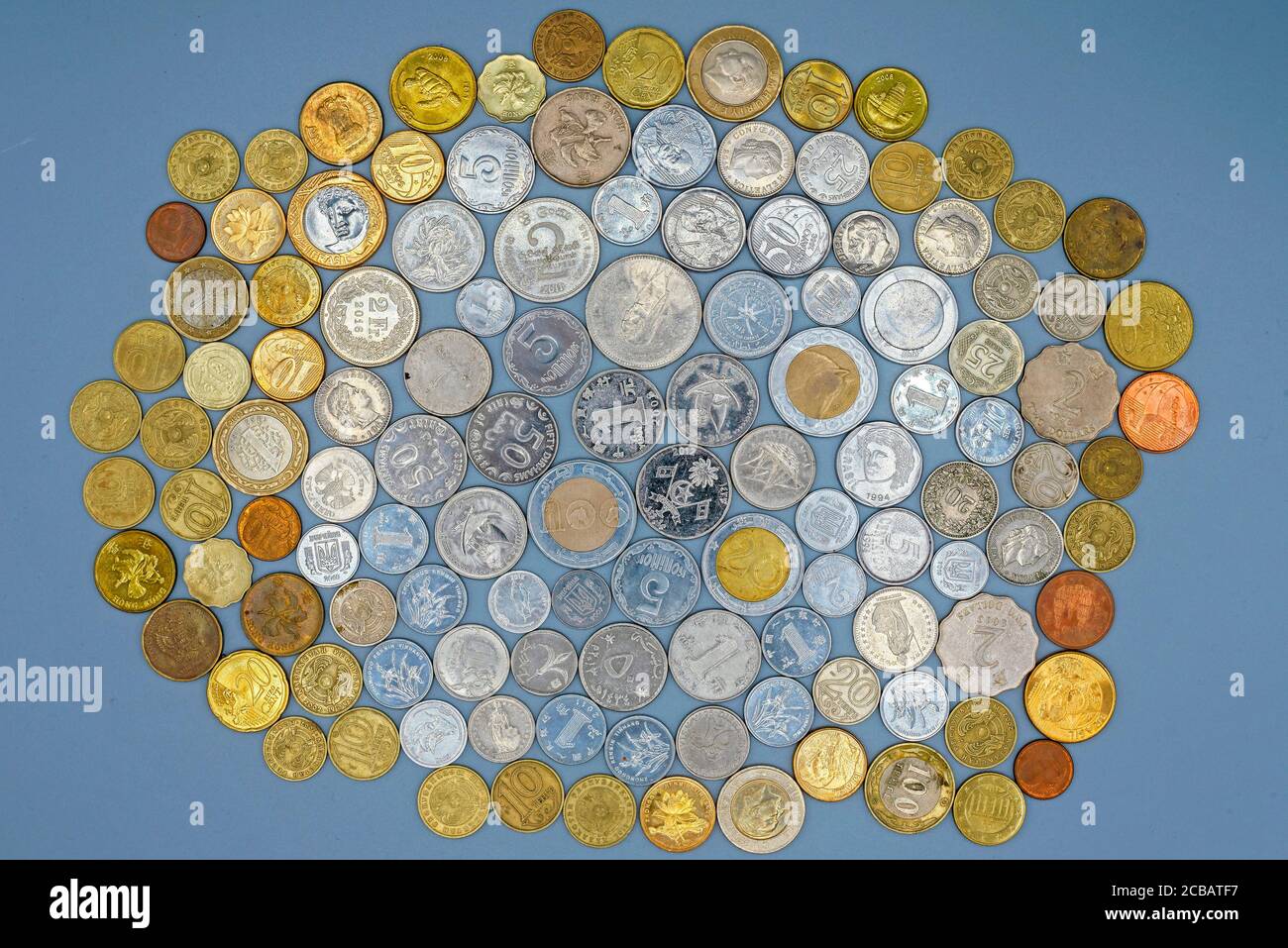mix of white and yellow coins from different countries Stock Photo - Alamy