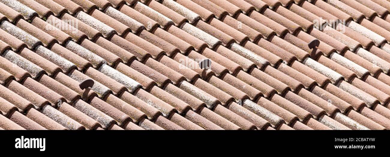 Typical European clay shingle roof construction Stock Photo - Alamy